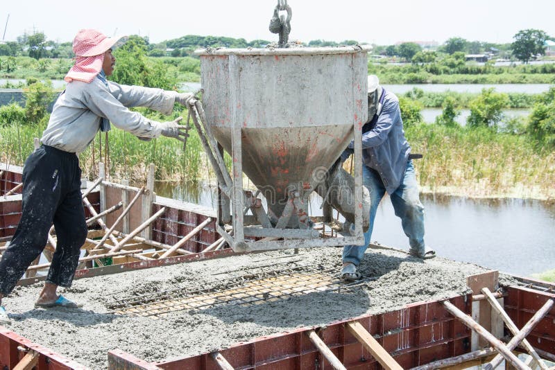 Worker pouring cement editorial image. Image of architect - 41221130