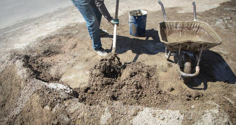 Worker Prepare Concrete with Shovel at Construction Site Stock Image ...