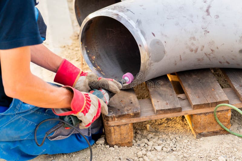 The Worker Prepares the Edge of the Weld Joint for Subsequent Welding ...