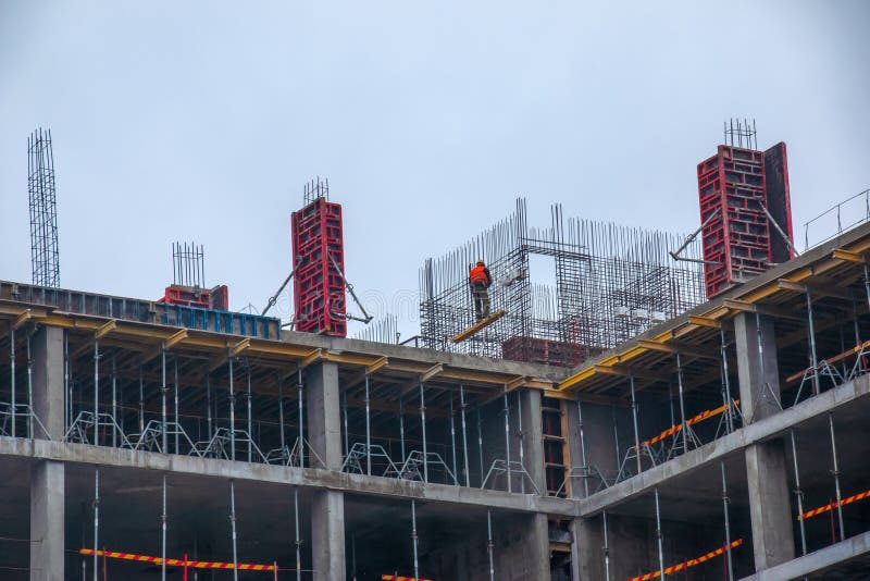 A Worker Prepares Formwork for a Modern Metal-concrete Structure of a ...