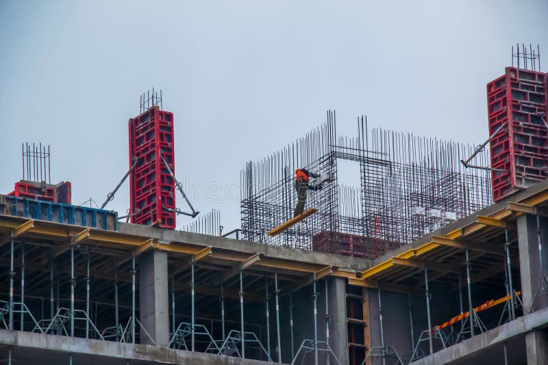 A Worker Prepares Formwork for a Modern Metal-concrete Structure of a ...