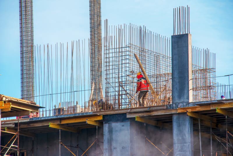 A Worker Prepares Formwork for a Modern Metal-concrete Structure of a ...