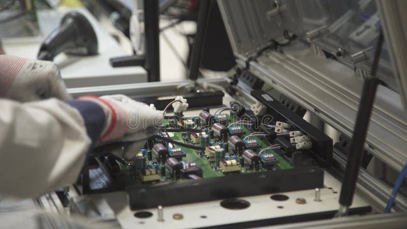 Worker Prepares Printed Circuit Boards with Components for Testing and ...