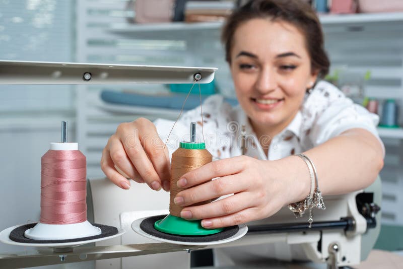 The Worker Prepares the Sewing Machine for Work Stock Image - Image of ...