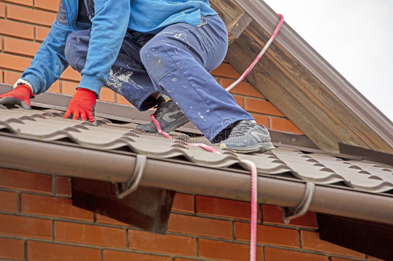 Worker Preparing before Installing Solar Panels on the Roof. Stock ...