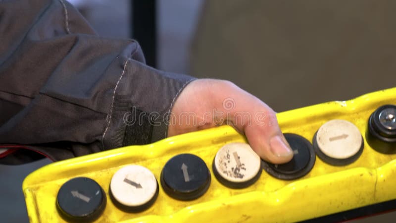 The Worker Presses the Button on the Control Panel of the Mechanism ...