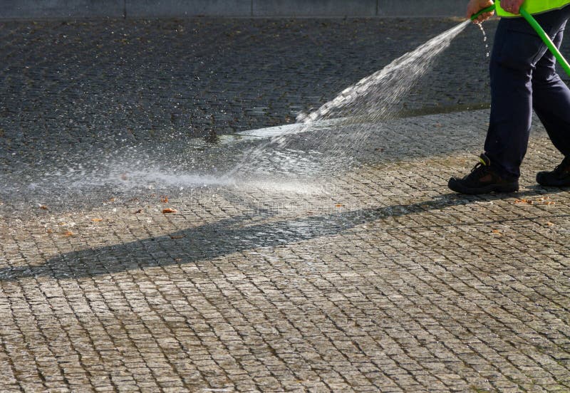 Wet cleaning of street. stock photo. Image of cleaner - 65662066