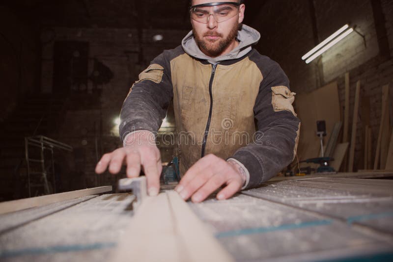 A Worker Processes a Board on a Woodworking Machine Stock Image - Image ...
