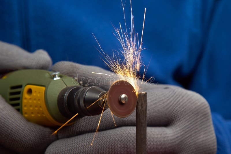 Worker Processes Metal with Engraving Drill Close-up. the Work of the ...