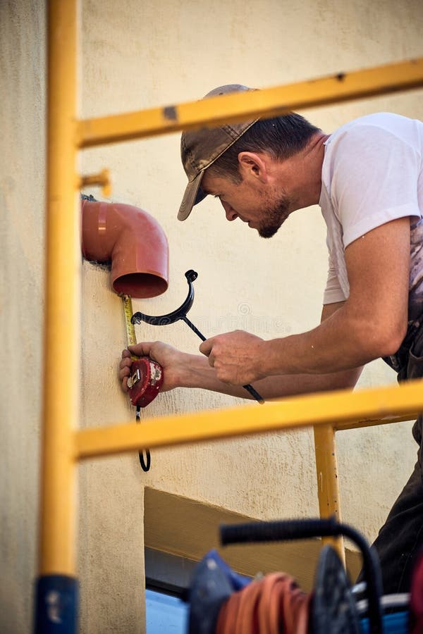 Builder at the Finish House Working with the Tool. Stock Image - Image ...