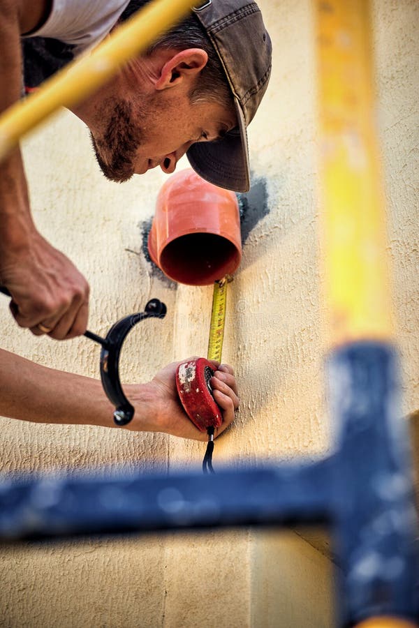 Builder at the Finish House Working with the Tool Stock Photo - Image ...