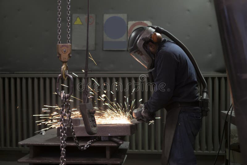 Worker with Protection Tools Working Inside a Factory Stock Photo ...