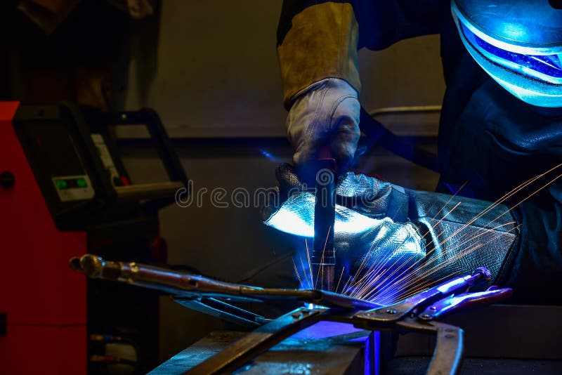 Worker with Protective Mask Welding Metal and Sparks Stock Image ...