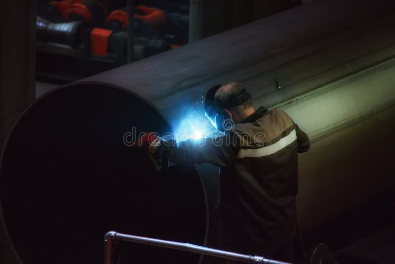 Worker in Protective Mask Welding Pipe in Factory Stock Image - Image ...
