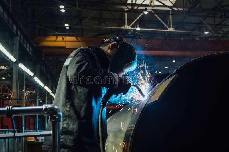 Worker in Protective Mask Welding Pipe in Factory Stock Photo - Image ...
