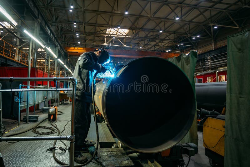 Worker in Protective Mask Welding Pipe in Factory Stock Image - Image ...