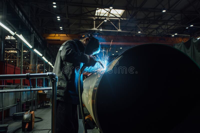 Worker in Protective Mask Welding Pipe in Factory Stock Photo - Image ...