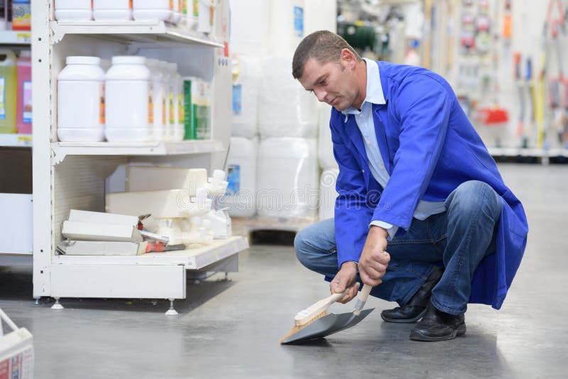 Worker in Protective Overalls Cleaning Floor in Store Stock Photo ...
