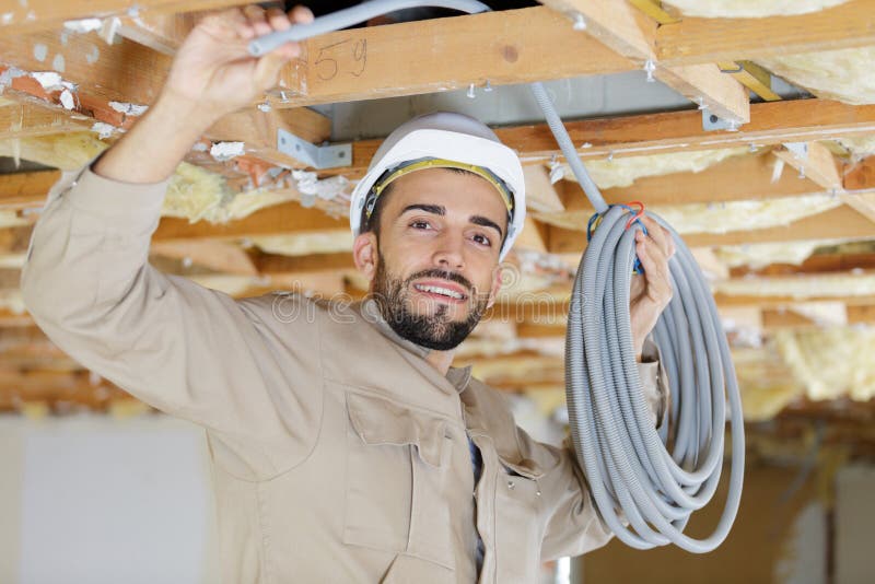 Worker Pulling Roll High Voltage Cable Line in Factory Stock Photo ...