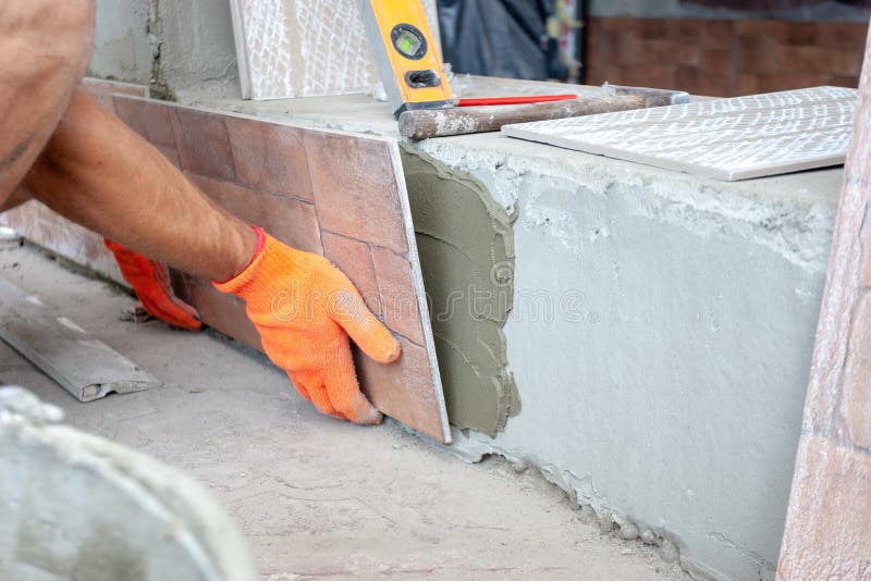Worker Pushing the Tile into the Cement. Renovation Concept Stock Image ...
