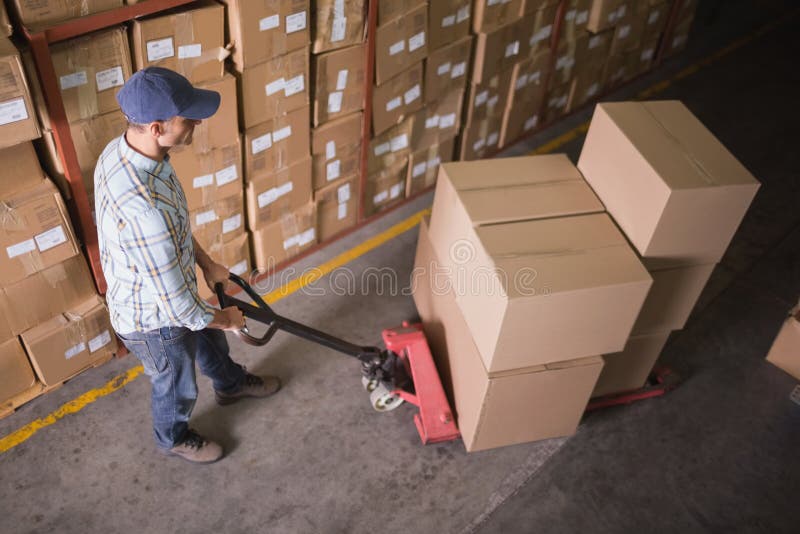Worker Pushing Trolley with Boxes in Warehouse Stock Image - Image of ...