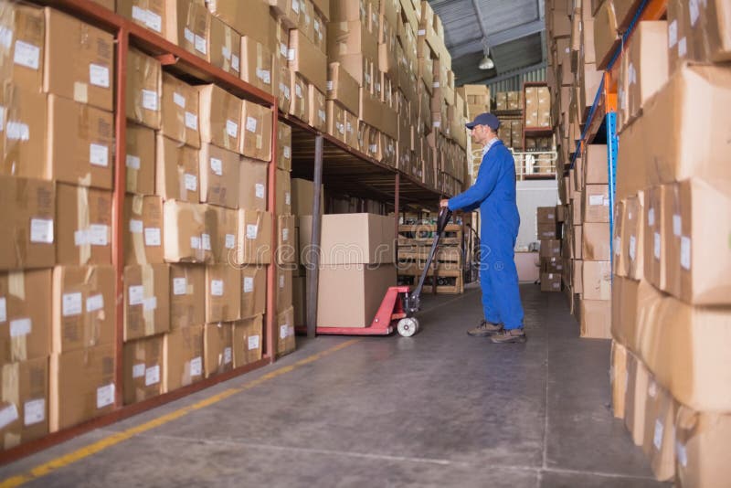 Worker Pushing Trolley with Boxes in Warehouse Stock Photo - Image of ...