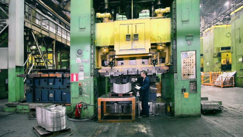 Worker Puts Component Under Press Machine at Huge Stock Video - Video ...