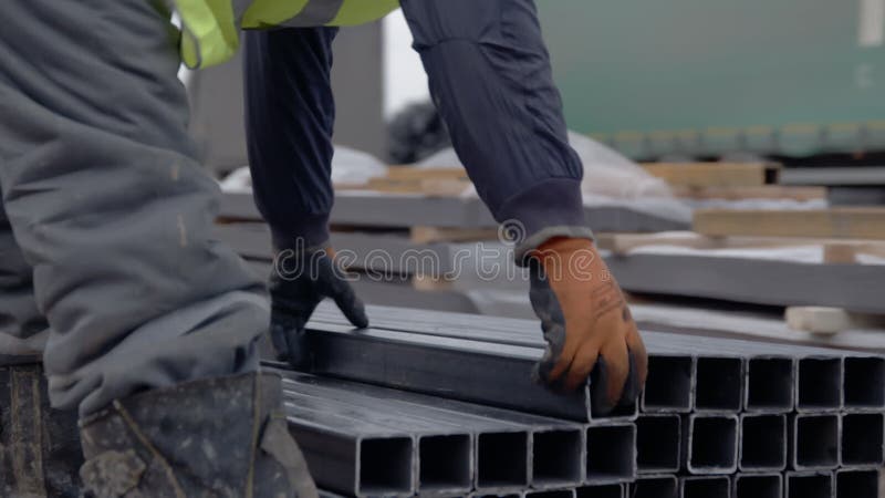 Worker Puts Square Hollow Section on Stack in Yard Stock Video - Video ...