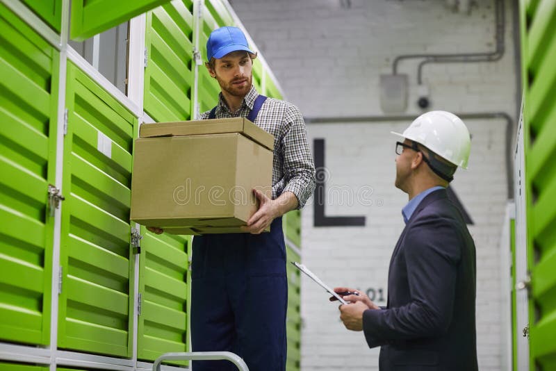 Worker Putting the Box into the Boxes Stock Image - Image of males ...