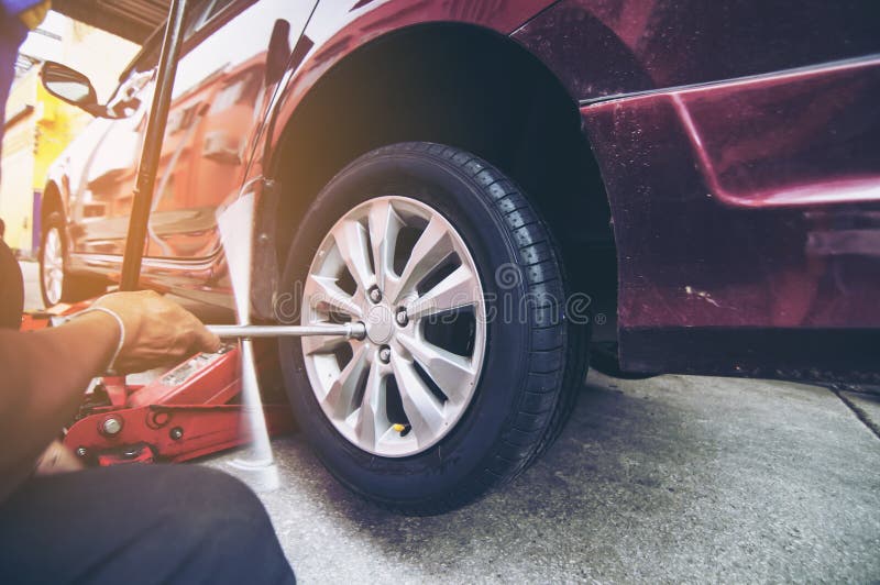 Worker Putting New Wheel To the Car Stock Image - Image of shine, auto ...