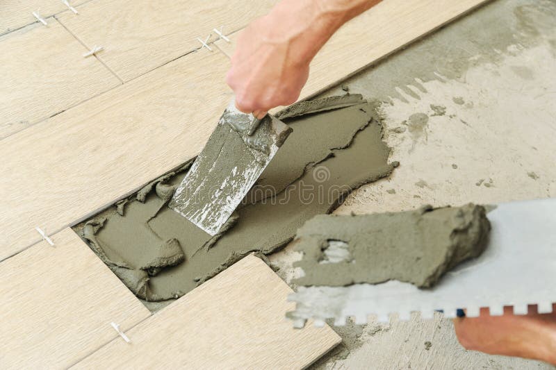 Worker Putting Tiles on the Floor. Stock Image - Image of concrete ...