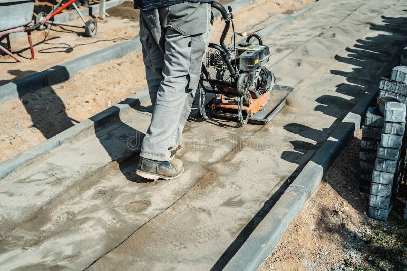 Vibrating Machine Packs Gravel for Concrete Project Stock Image - Image ...