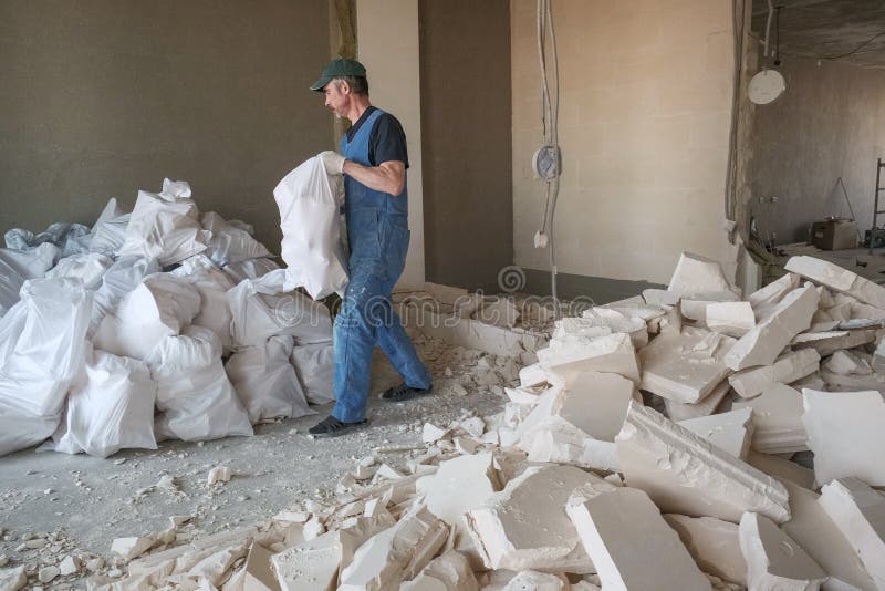 Worker Removes Debris from the Destroyed Wall Stock Image - Image of ...