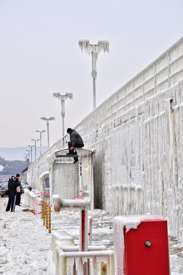Worker Removes Ice from Frosted Bus Stop Editorial Stock Image - Image ...