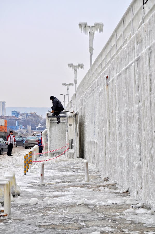 Worker Removes Ice from Frosted Bus Stop Editorial Photography - Image ...