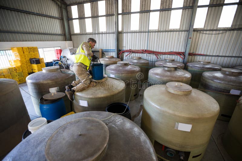 Worker Removing Oil Tank Stock Photos - Free & Royalty-Free Stock ...