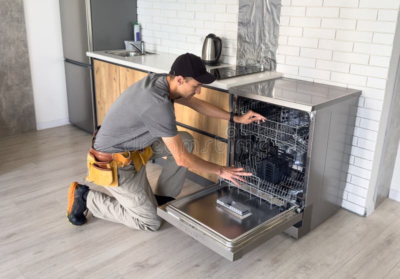 Worker Repair Dishwasher at Home. Stock Image - Image of electrical ...