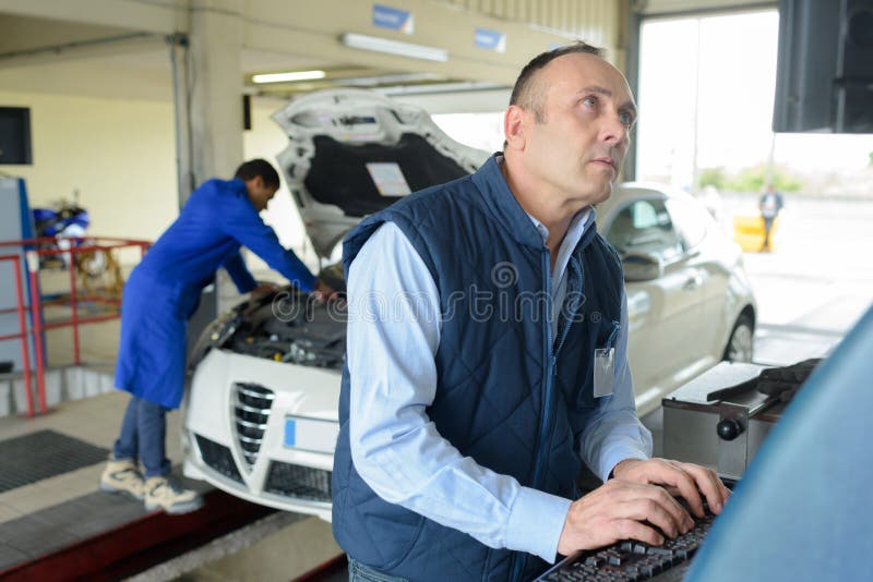 Worker at repair station stock image. Image of computer - 103100677