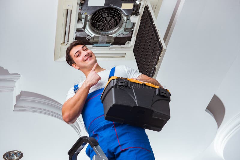 The Worker Repairing Ceiling Air Conditioning Unit Stock Image - Image ...