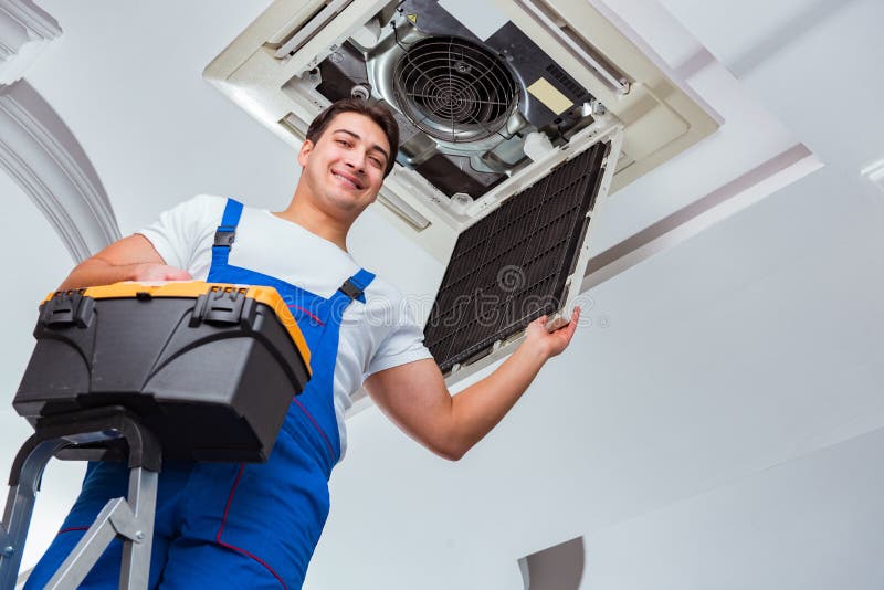 The Worker Repairing Ceiling Air Conditioning Unit Stock Photo - Image ...