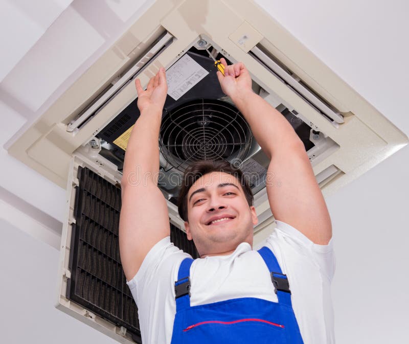 Worker Repairing Ceiling Air Conditioning Unit Stock Photo - Image of ...