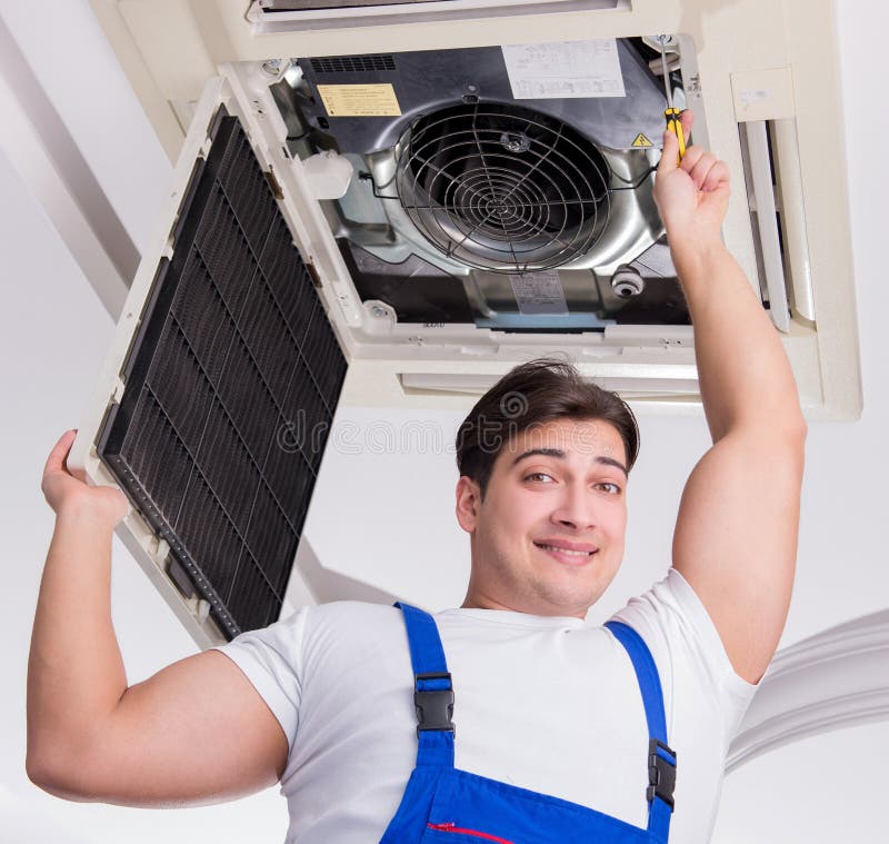 Worker Repairing Ceiling Air Conditioning Unit Stock Image - Image of ...