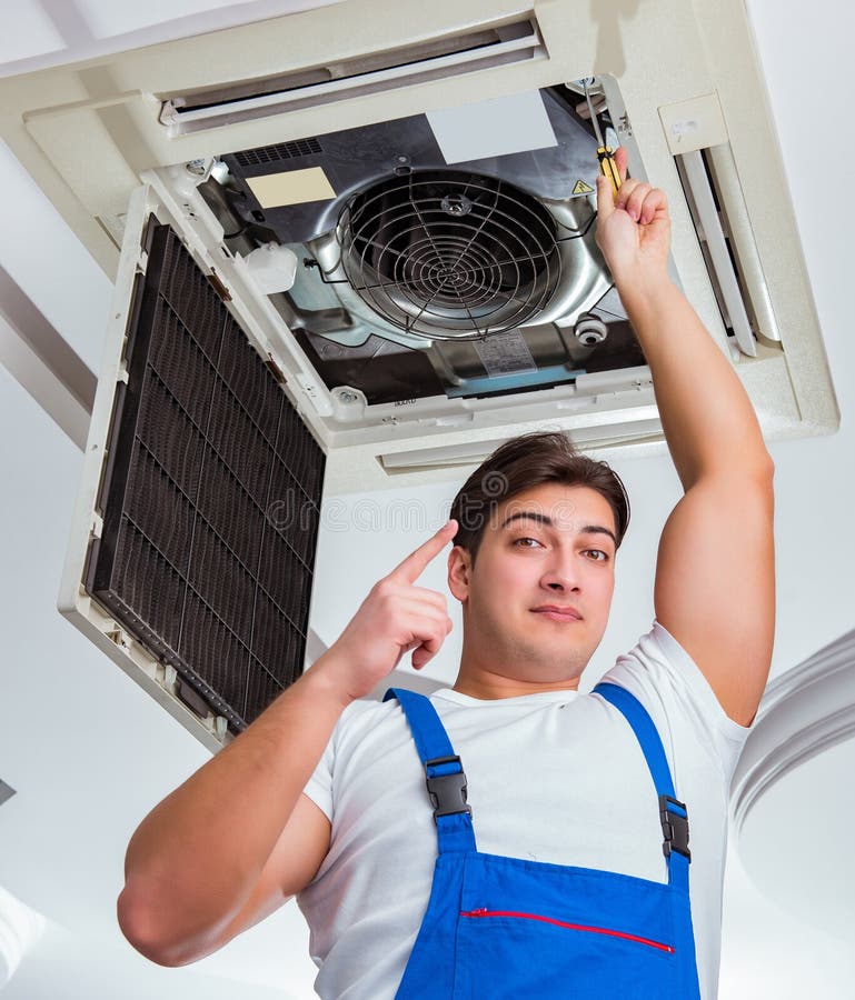 Worker Repairing Ceiling Air Conditioning Unit Stock Image - Image of ...