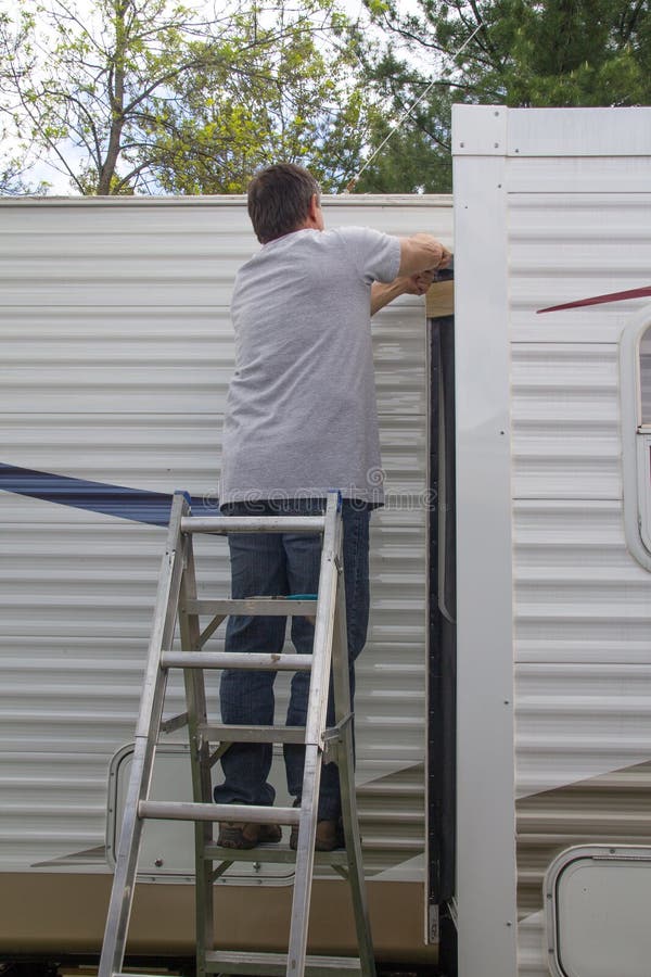 Worker Repairing Mobile Home Stock Photo - Image of improvement, person ...