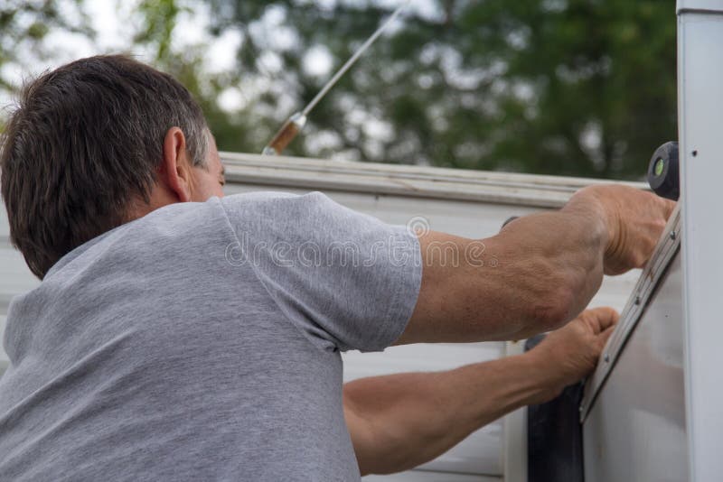 Worker Repairing Mobile Home Stock Photo - Image of structure, person ...