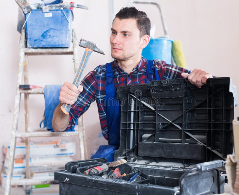 Worker Looking Fo Tool in Toolbox Stock Photo - Image of young, worker ...
