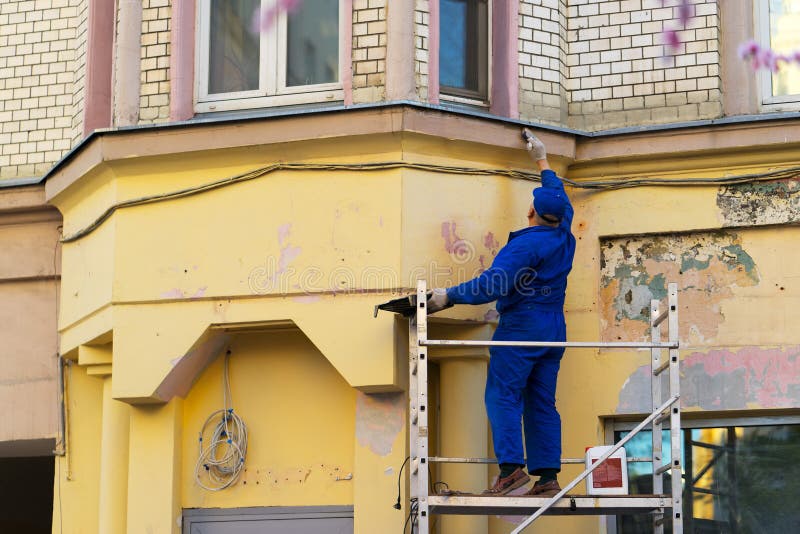 A Worker Repairing the Wall of a Building Editorial Image - Image of ...