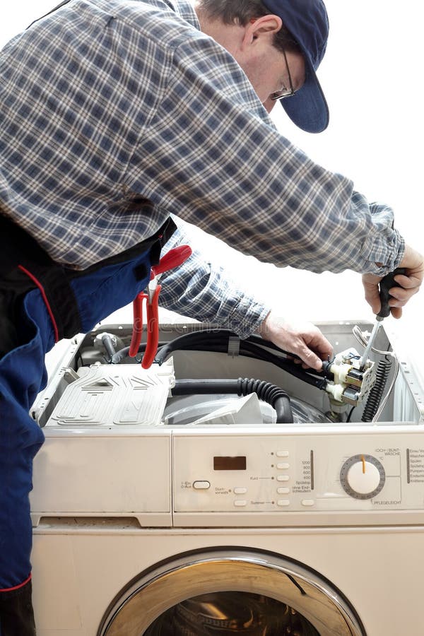 Worker is Repairing a Washing Machine Stock Image - Image of serious ...