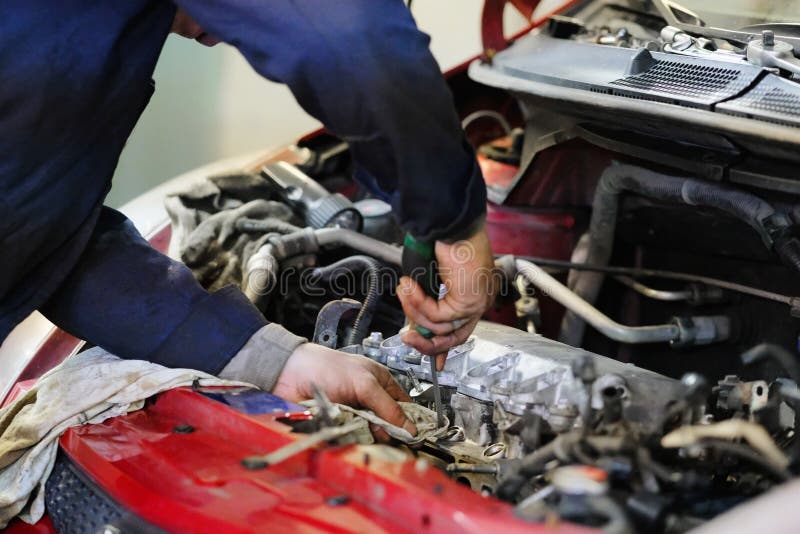 Worker repairs a car stock photo. Image of problem, hood - 79994502