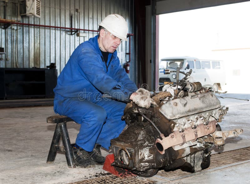 Worker repairs a motor stock image. Image of checking - 42360995